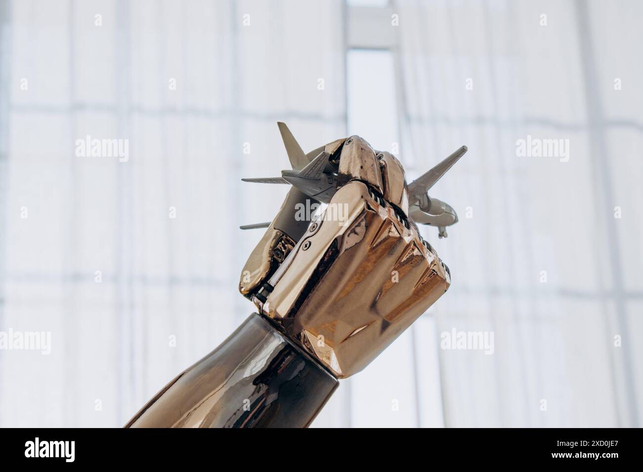 A close-up of a robotic bionic arm with metal spikes simulates the ...