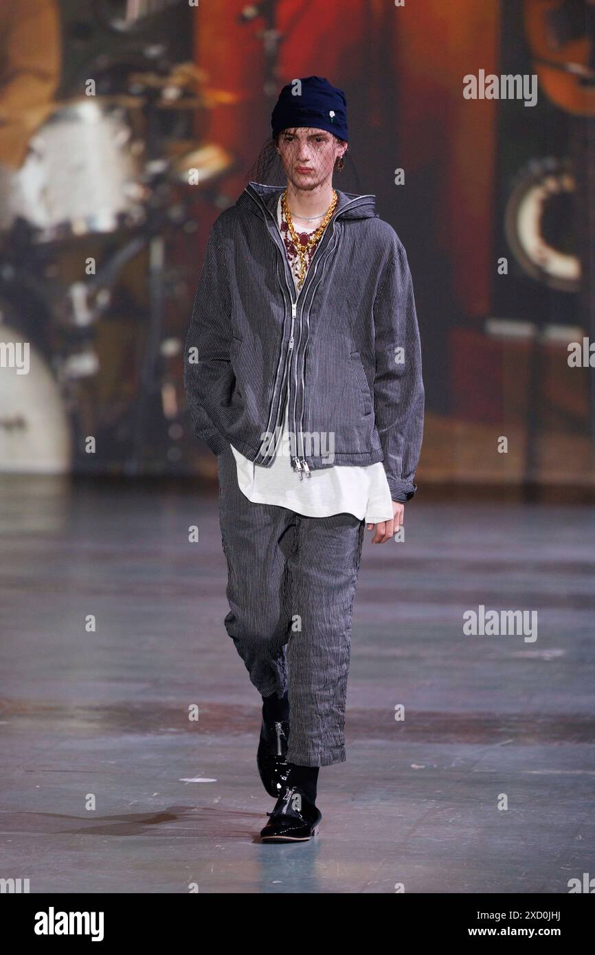 A model wears a creation for the Undercover Spring Summer 2025 ...