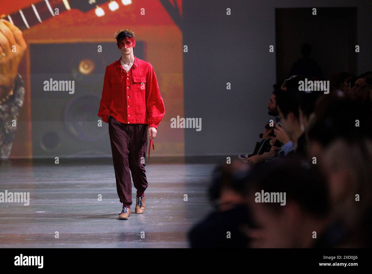 A model wears a creation for the Undercover Spring Summer 2025 ...