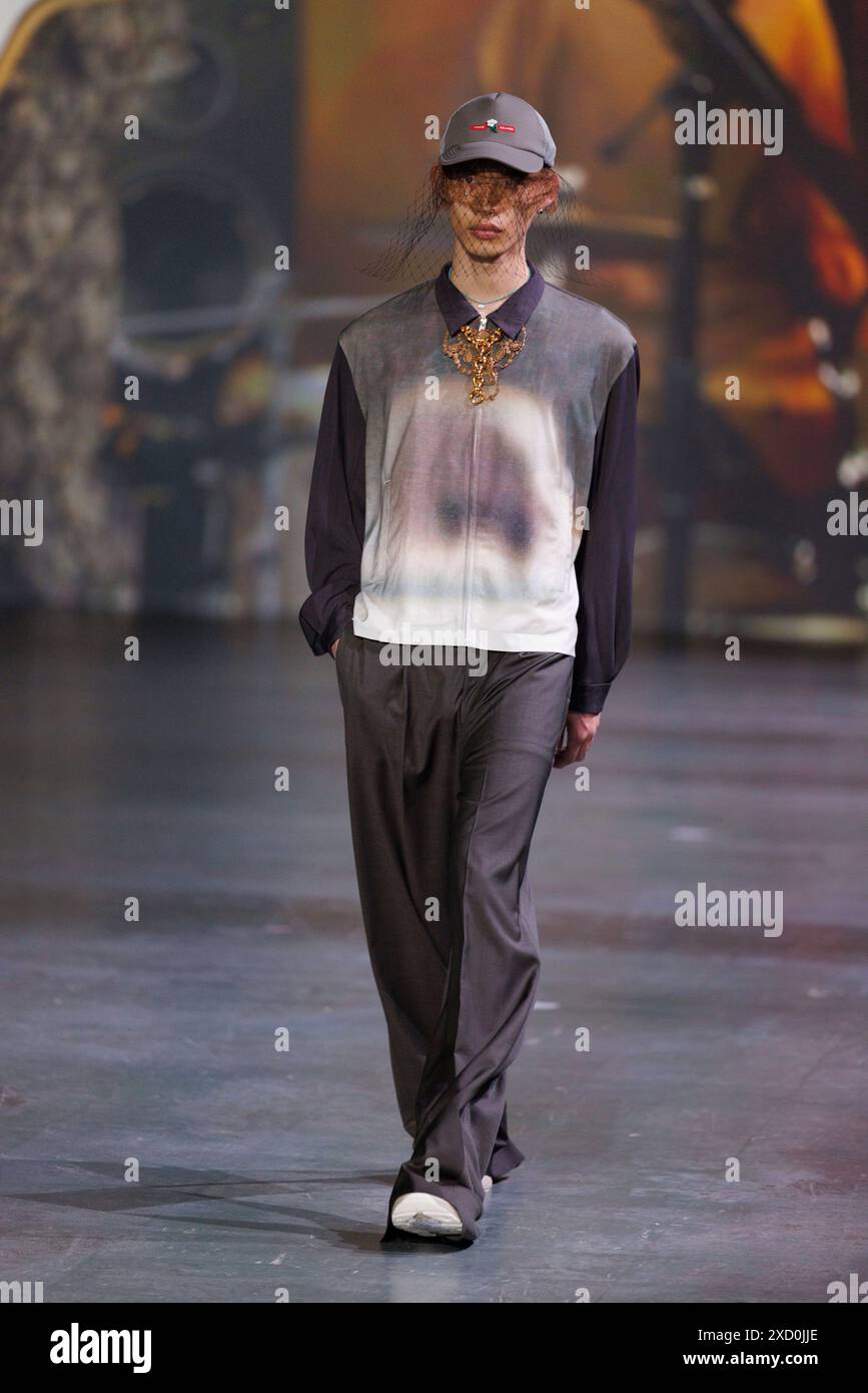 A model wears a creation for the Undercover Spring Summer 2025 ...