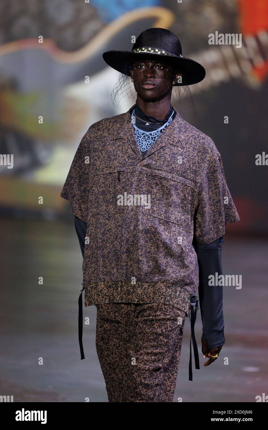 A model wears a creation for the Undercover Spring Summer 2025 ...