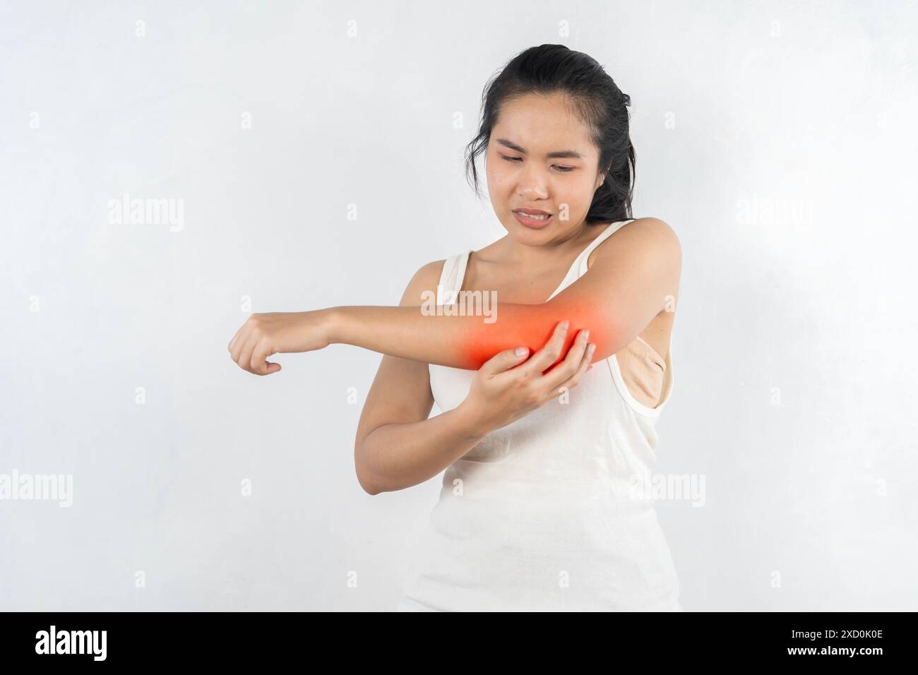 Woman having elbow ache during sitting on couch at home, muscle pain ...