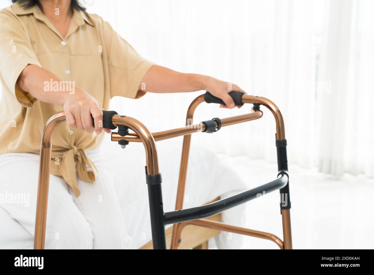 Elderly and walker.Elderly woman standing with walker. Senior woman ...