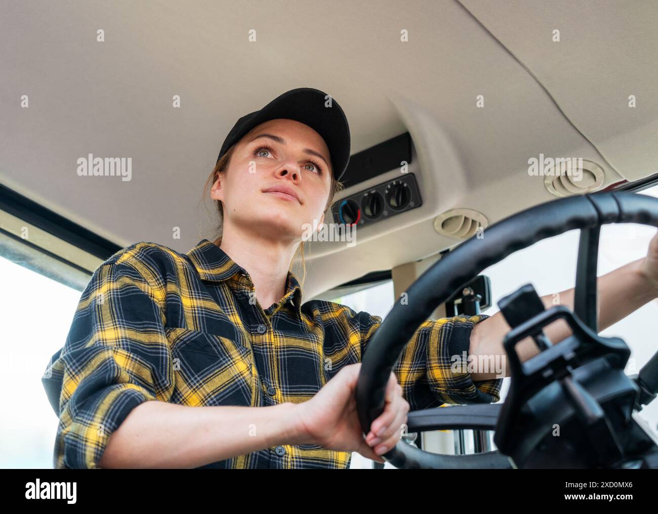Photo of woman farm tractor driver Stock Photo - Alamy