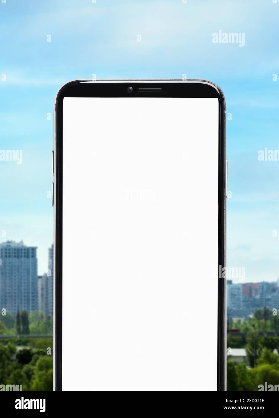 Mobile phone with empty screen against city view. Space for design ...