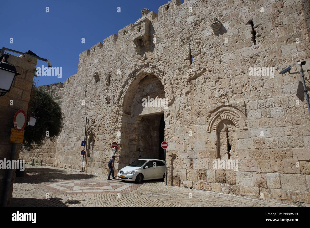 Car exits Zion Gate a person goes in, one of eight gates to Jerusalem ...