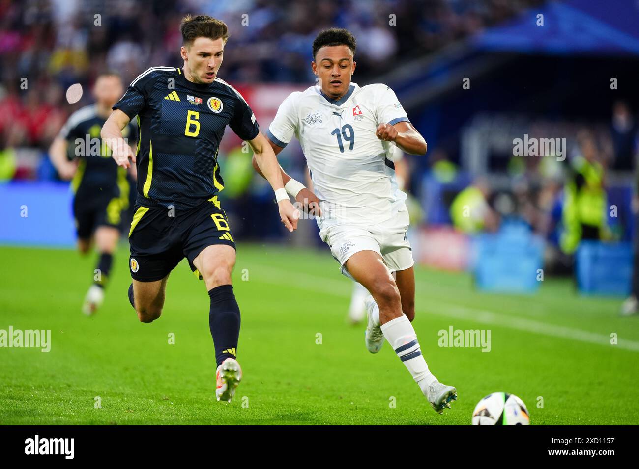 Scotland's Kieran Tierney (left) and Switzerland's Dan Ndoye battle for ...
