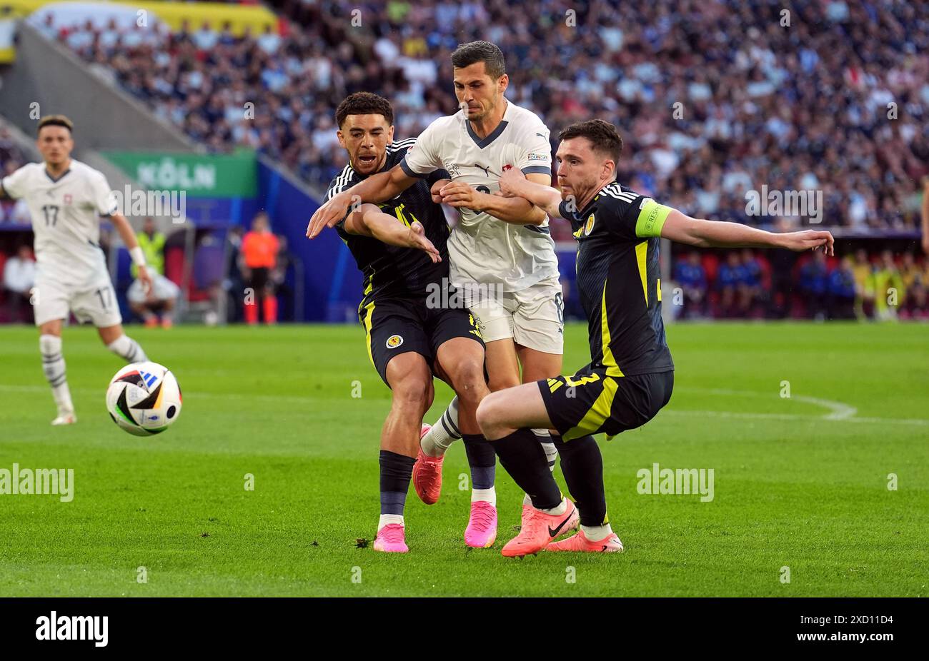 Scotland's Che Adams and Andrew Robertson (right) tackle Switzerland's ...