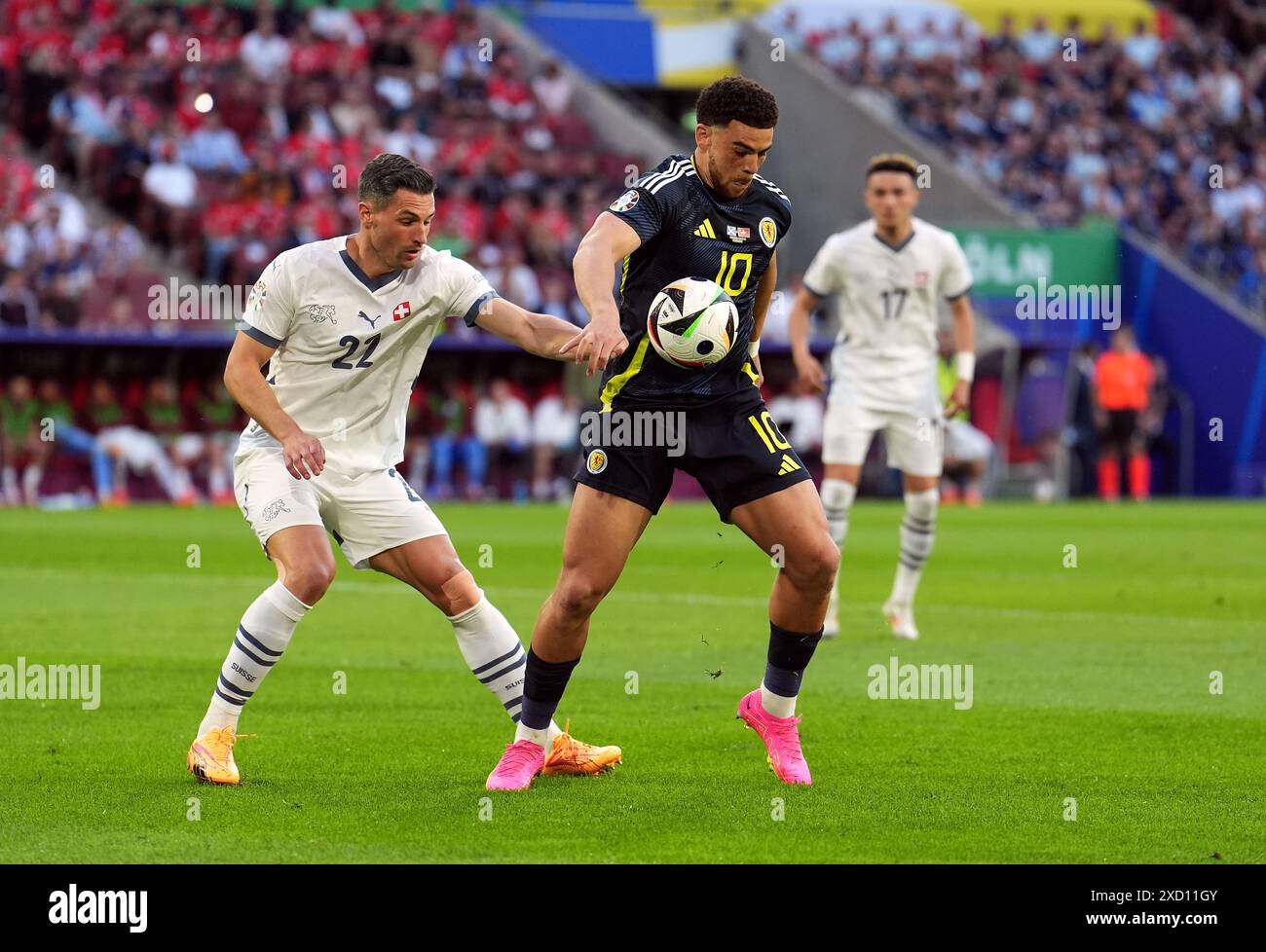 Switzerland's Fabian Schar and Scotland's Che Adams (right) during the ...