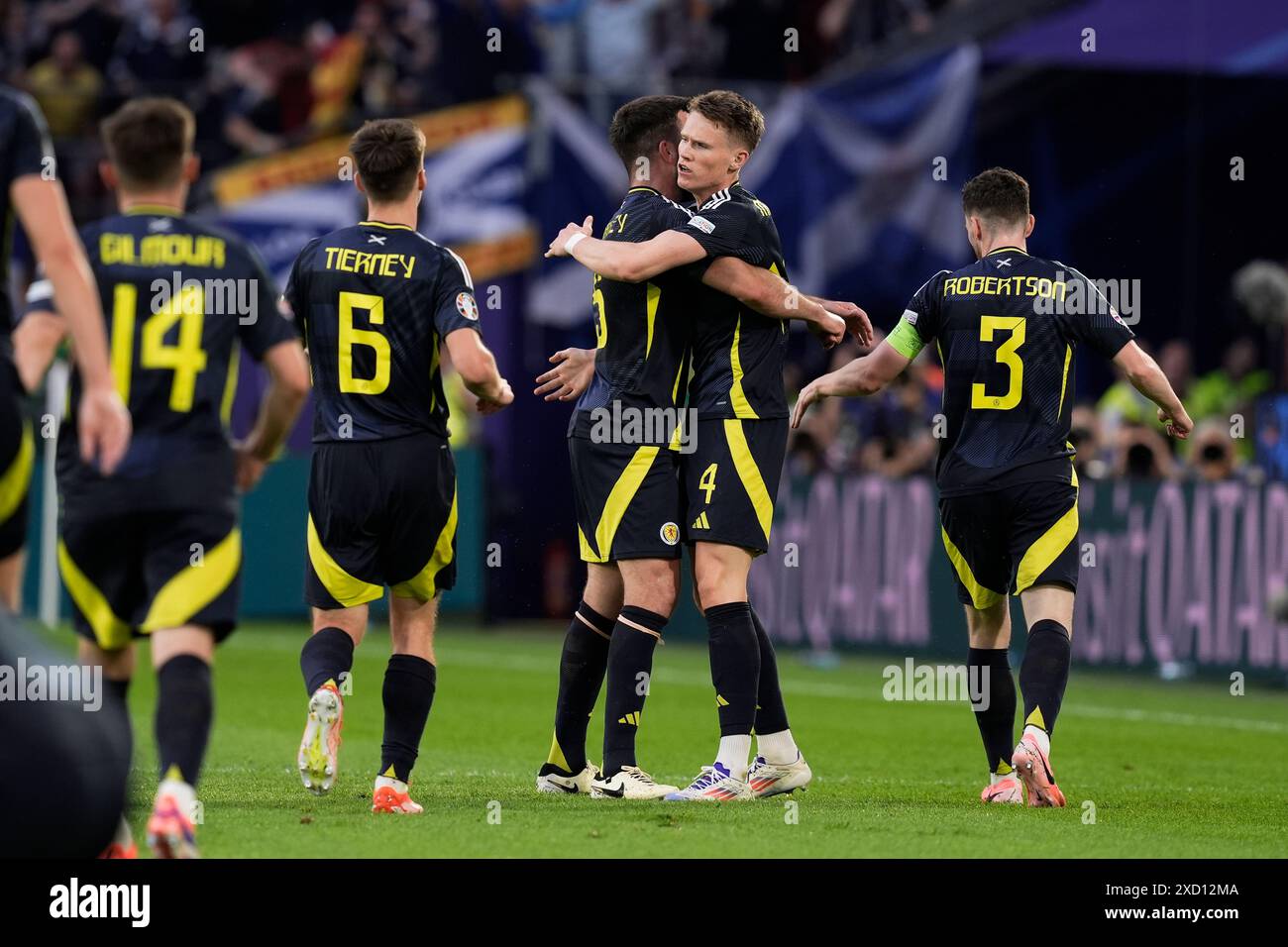 Cologne, Germany. 19th June, 2024. Scotland's Scott McTominay and ...