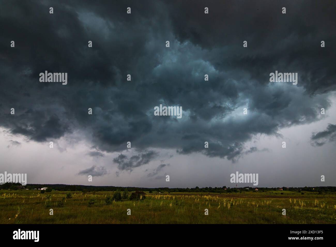 The harvest in the fields of Montana. The enormous storm cloud covered ...