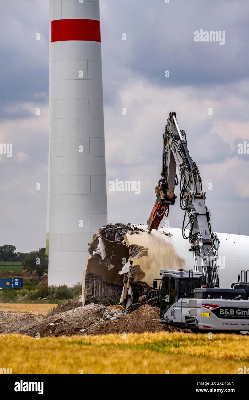 Demolished tower of a 20 year old wind turbine, in the Werl wind farm ...