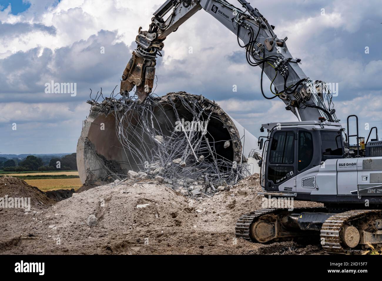 Demolished tower of a 20 year old wind turbine, in the Werl wind farm ...