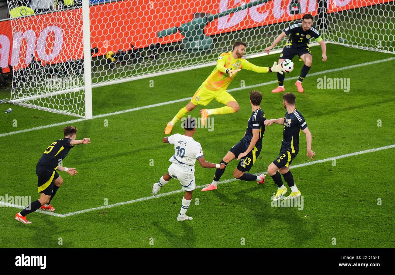 Scotland goalkeeper Angus Gunn saves from Switzerland's Dan Ndoye ...
