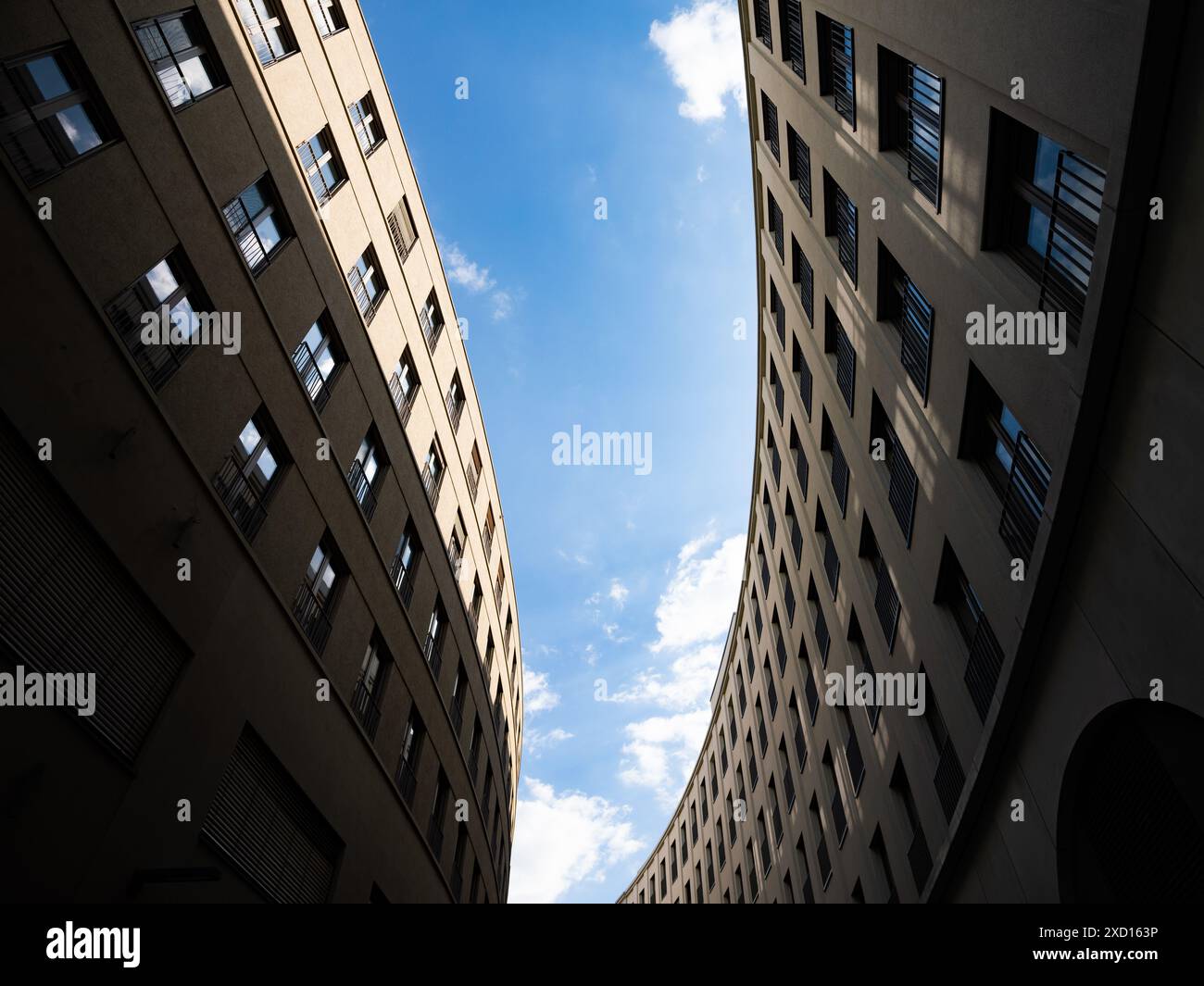 Modern building facades forming a circular arc. Low angle view to the ...