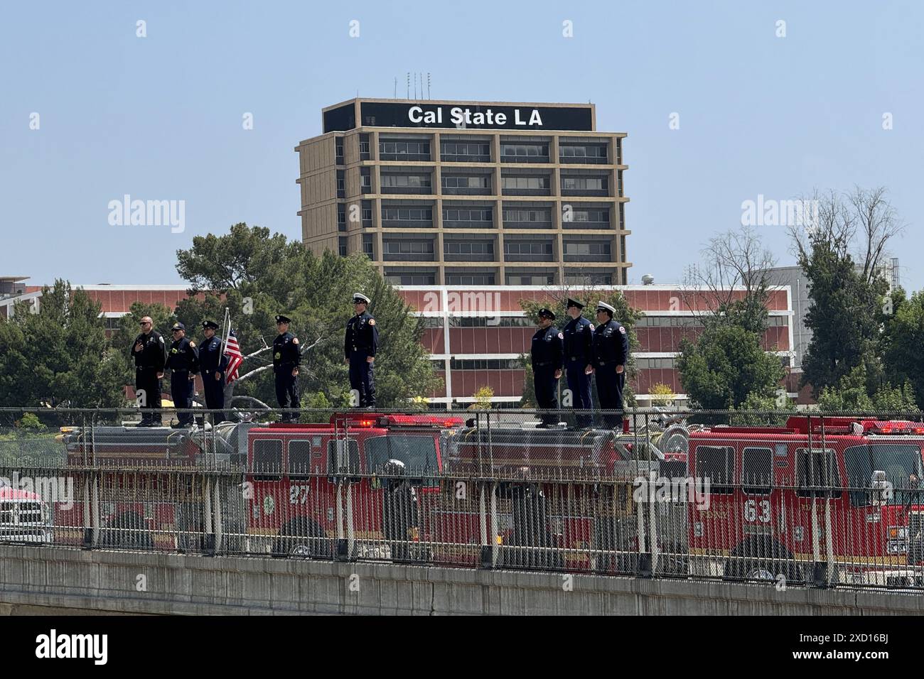 Los Angeles County and Monterey Park Fire Dept. firefighters stand in ...