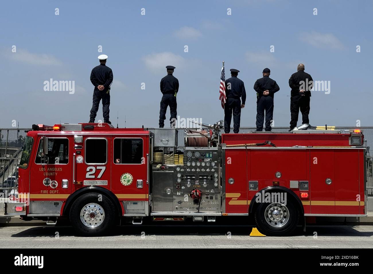 Los Angeles County Fire Dept. firefighters stand in salute for a ...