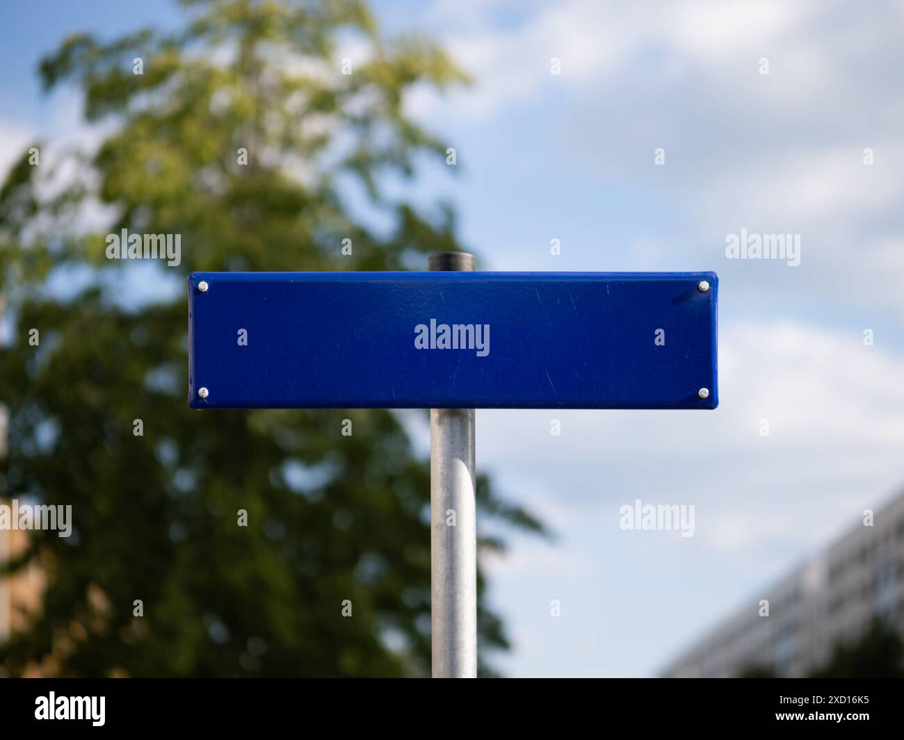 Empty street name sign as a template and copy space. Blue metal plate ...