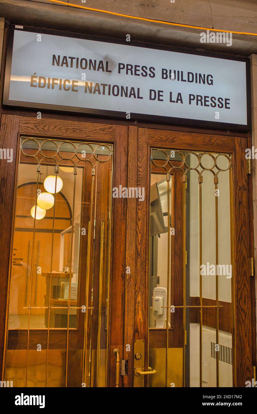 The entrance to the National Press Building, featuring a pair of wooden ...