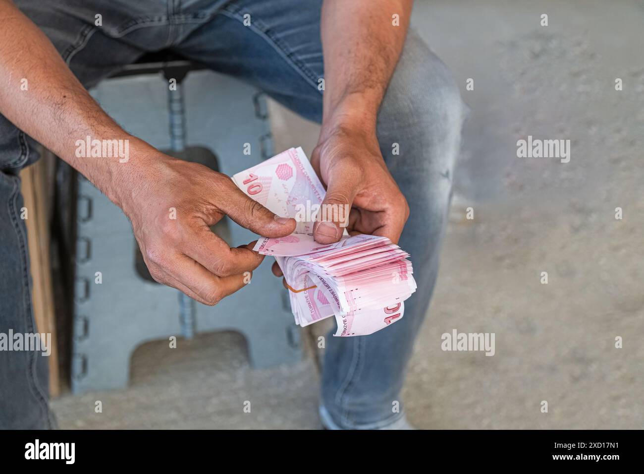 Hands holding a pile of money. Turkish Lira paper currency Stock Photo ...