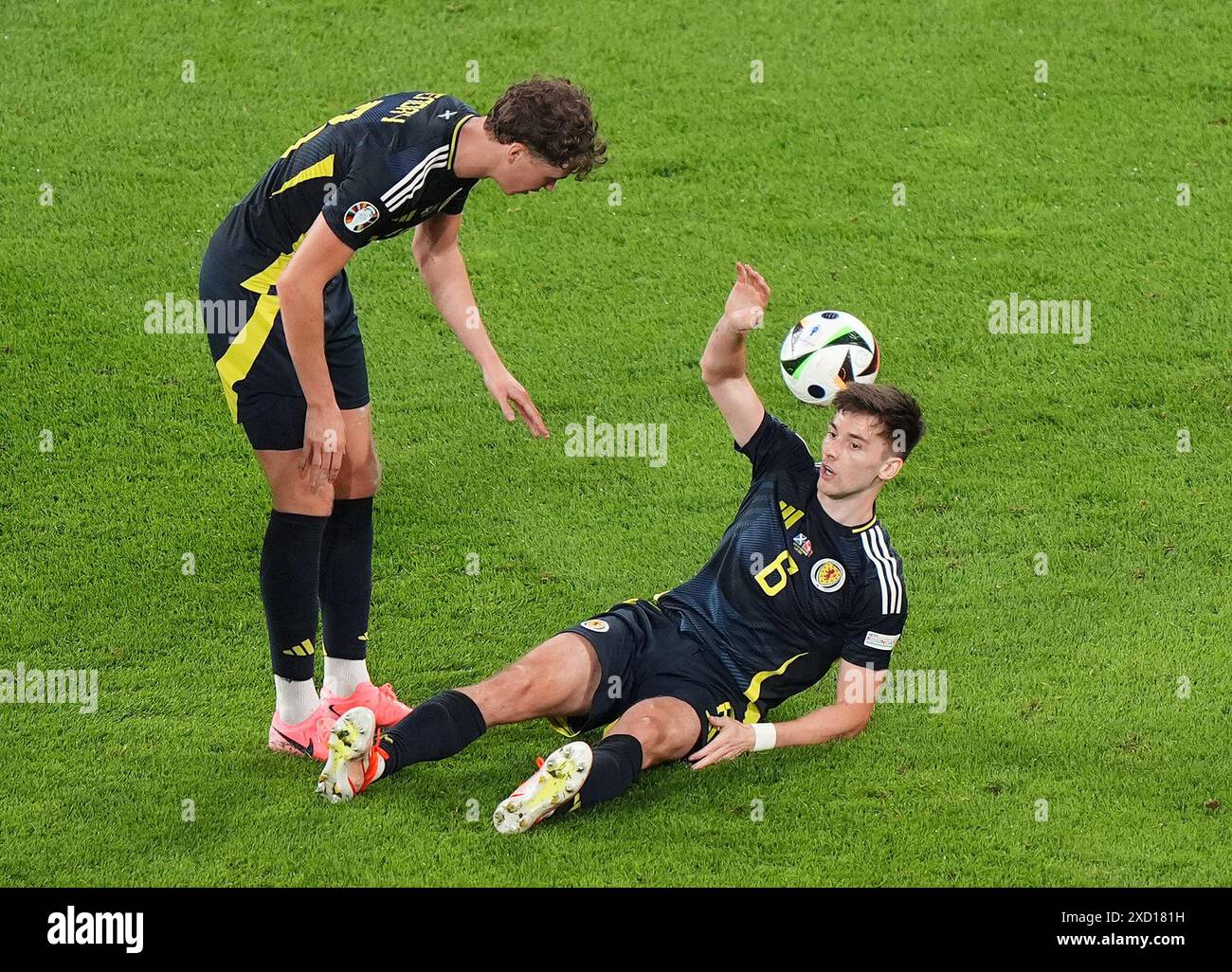Scotland's Kieran Tierney (right) signals he can no longer continue ...