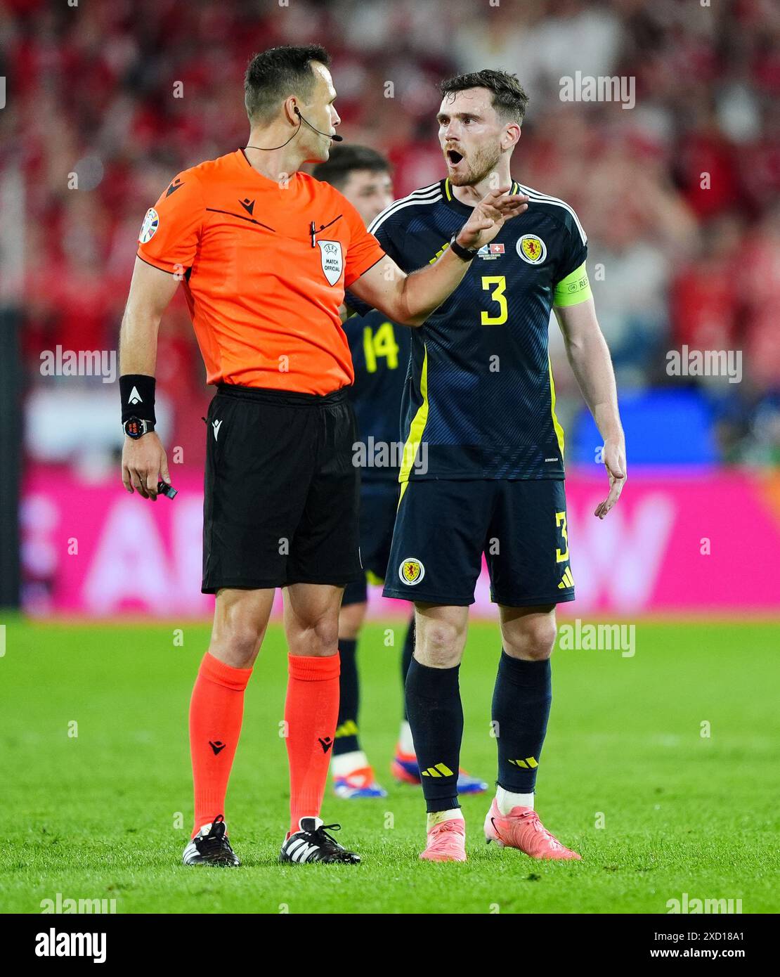 Scotland's Andrew Robertson (right) speaks with match referee Ivan ...