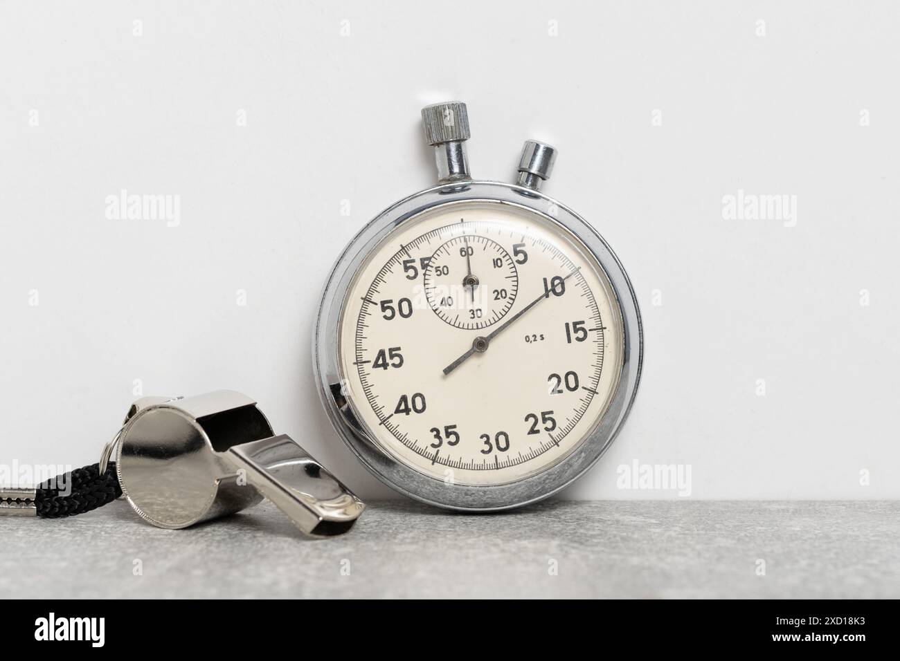 Stopwatch and whistle on white background. Close-up Stock Photo - Alamy