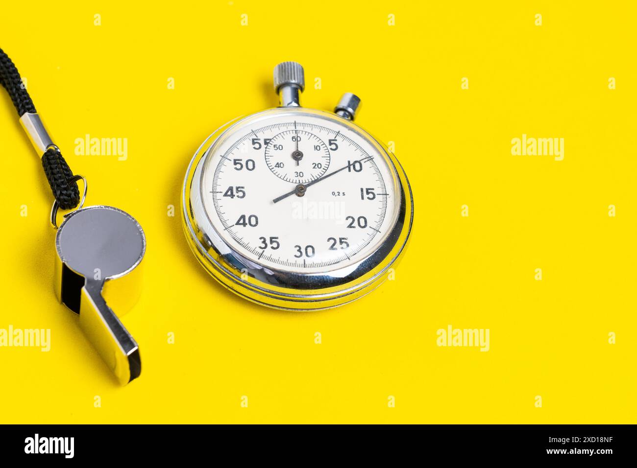Stopwatch and whistle on yellow background. Time management concept ...