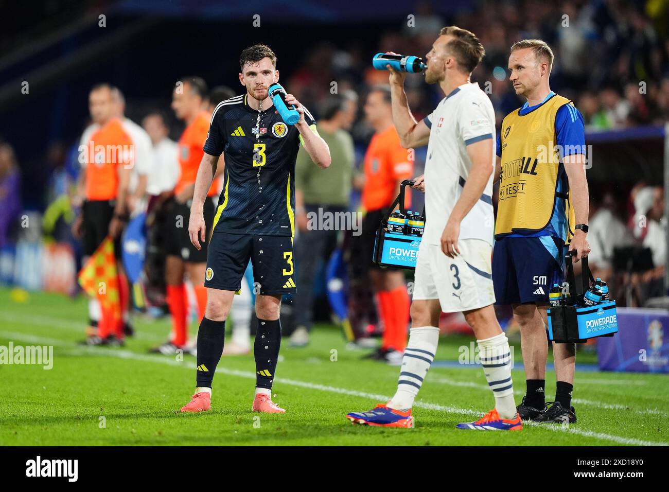 Scotland's Andrew Robertson (left) and Switzerland's Silvan Widmer take ...