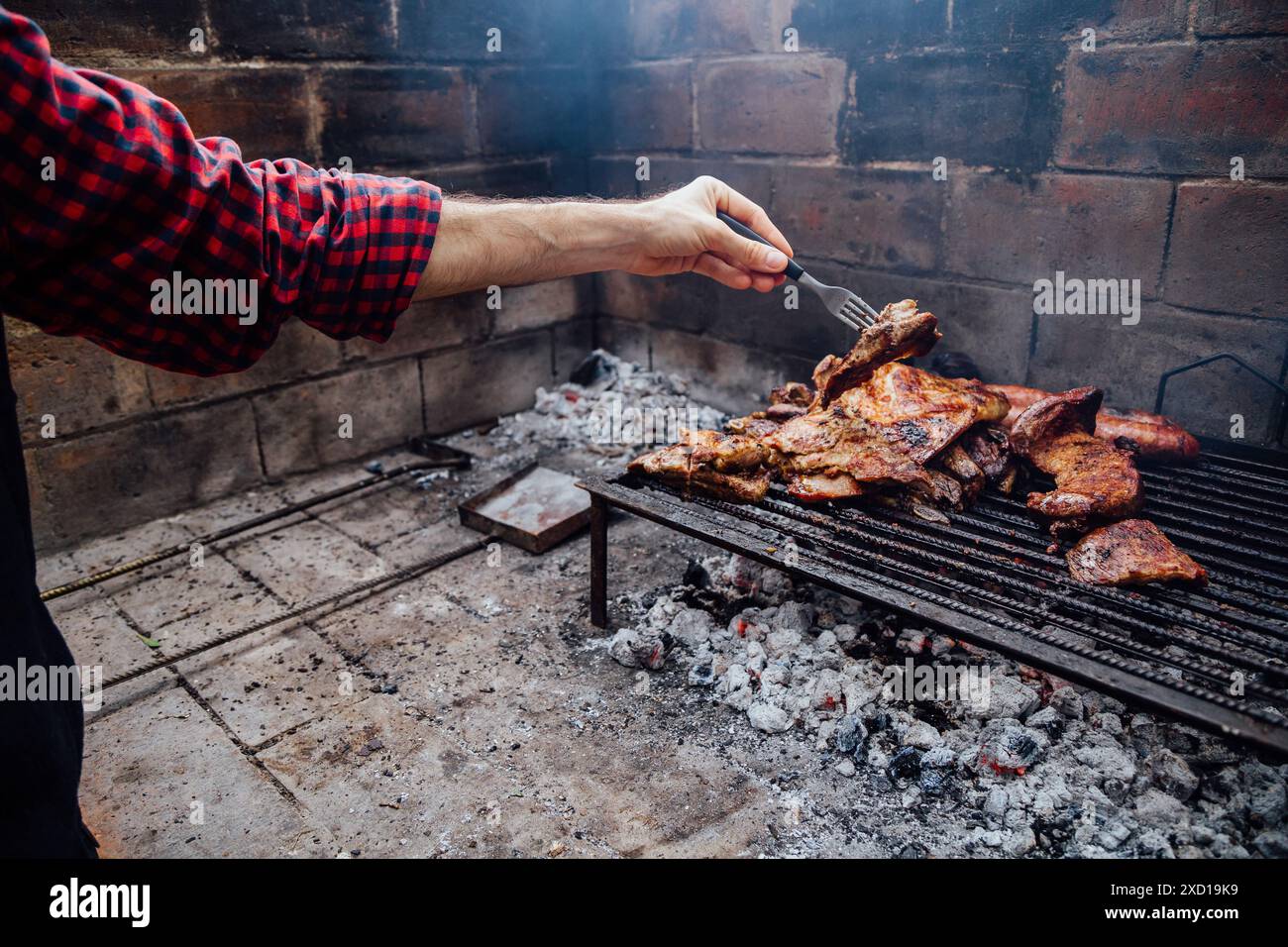 Argentinian asado made on the grill with different cuts of meat ...