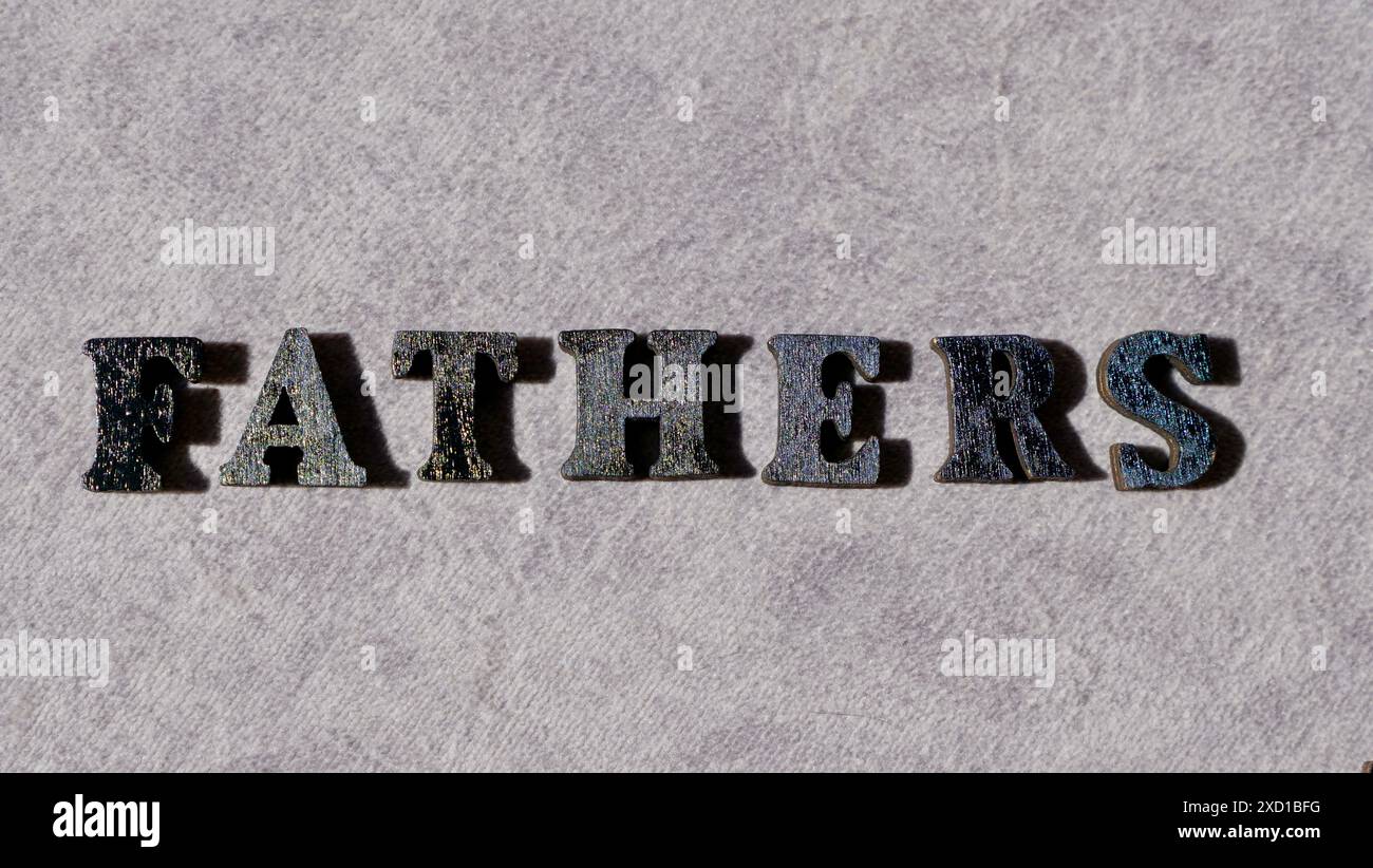 Lettering father in black letters on grey background on father's day ...
