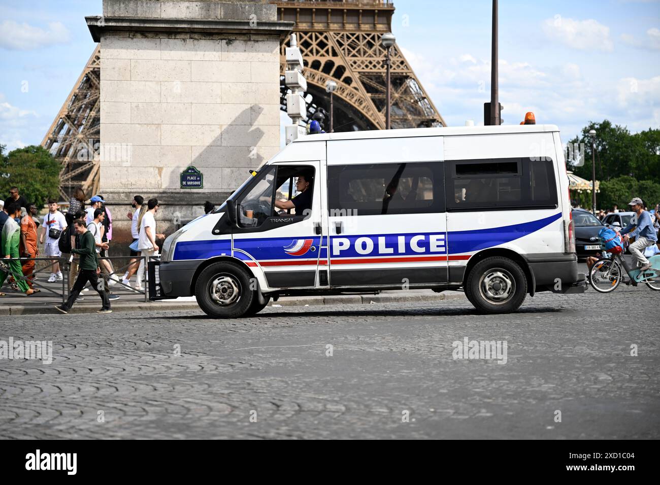 Paris, France. 12th June, 2024. A police car (truck, van) drives ...