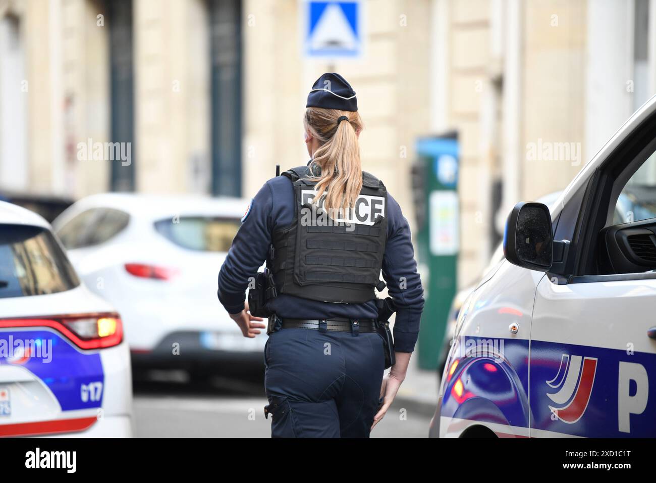 Paris, France. 12th June, 2024. A female police officer (woman) with ...