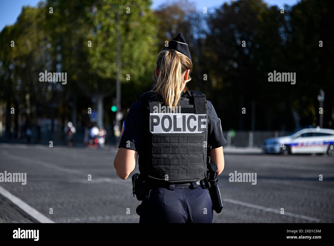 Paris, France. 12th June, 2024. A female police officer (woman) with ...