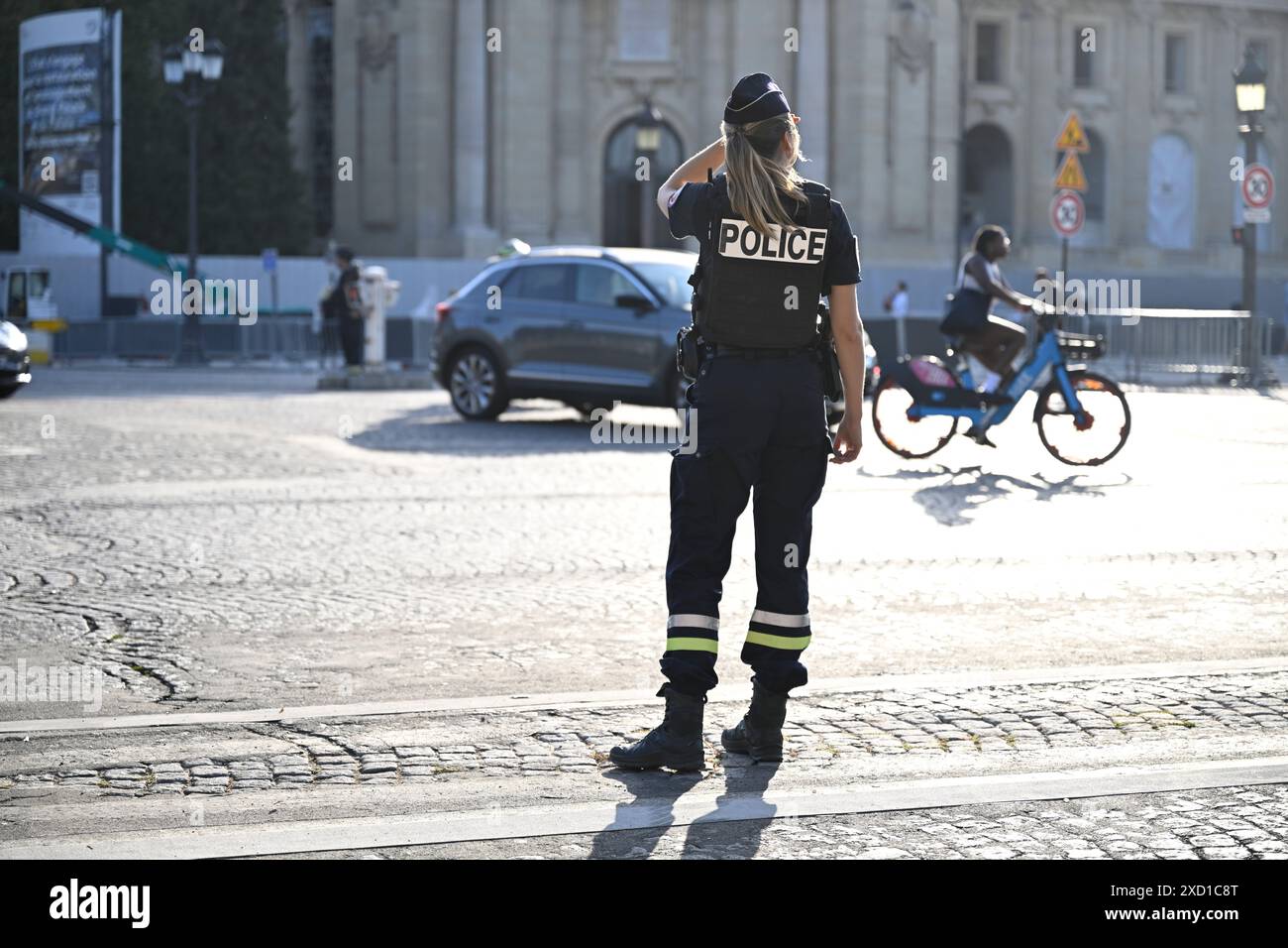 Paris, France. 12th June, 2024. A female police officer (woman) with ...