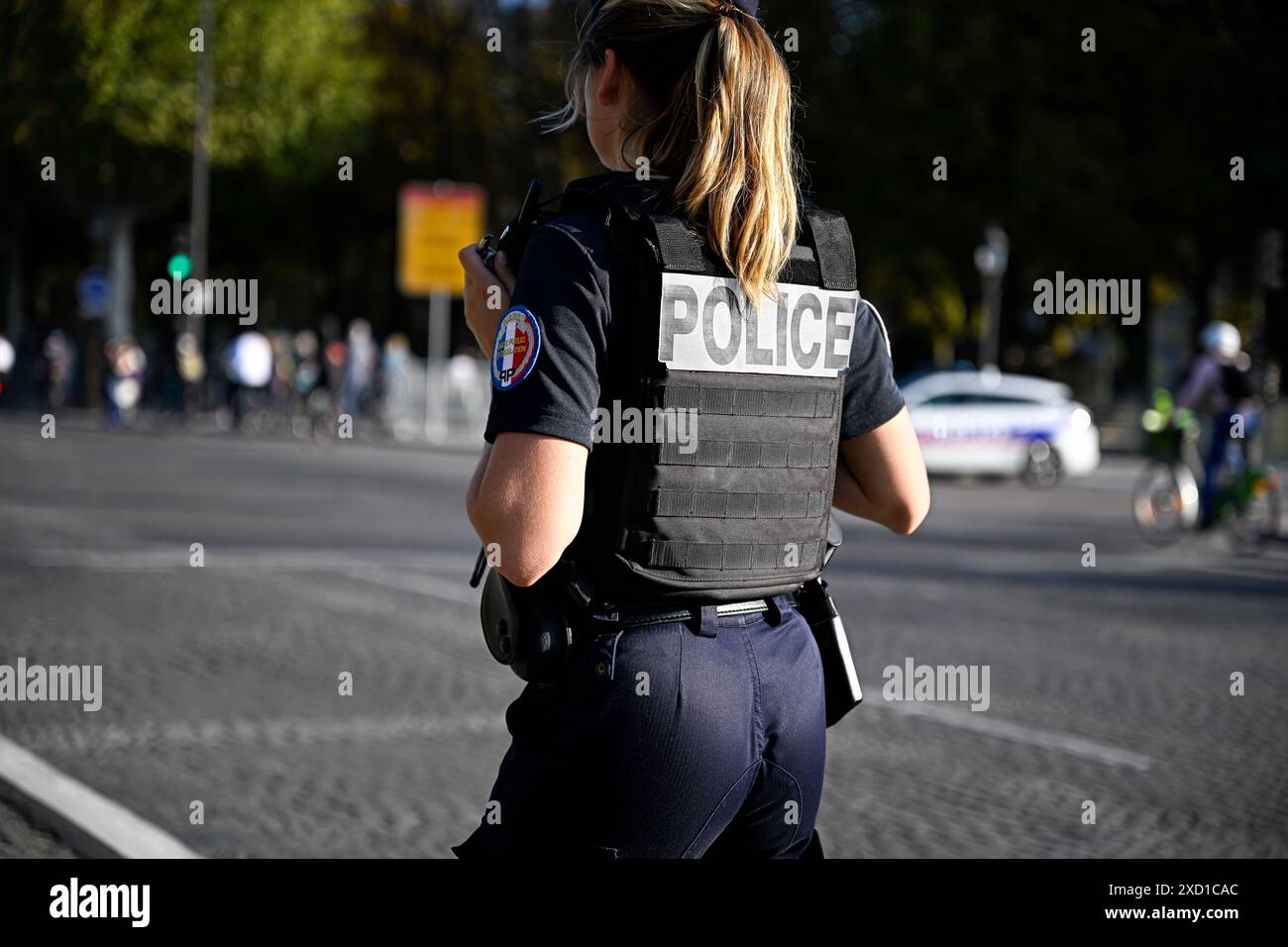 Paris, France. 12th June, 2024. A female police officer (woman) with ...