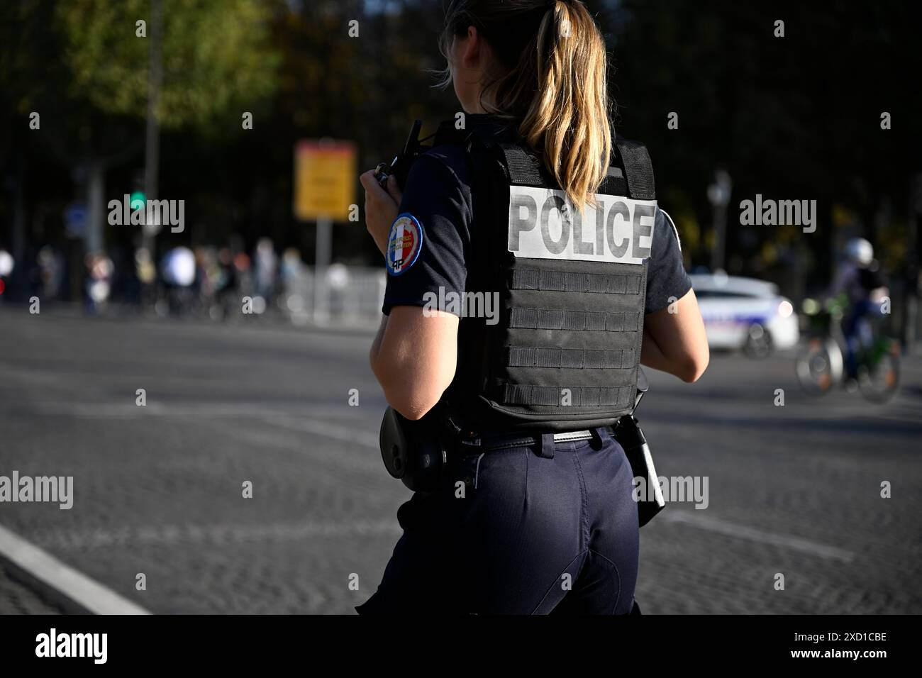 Paris, France. 12th June, 2024. A female police officer (woman) with ...