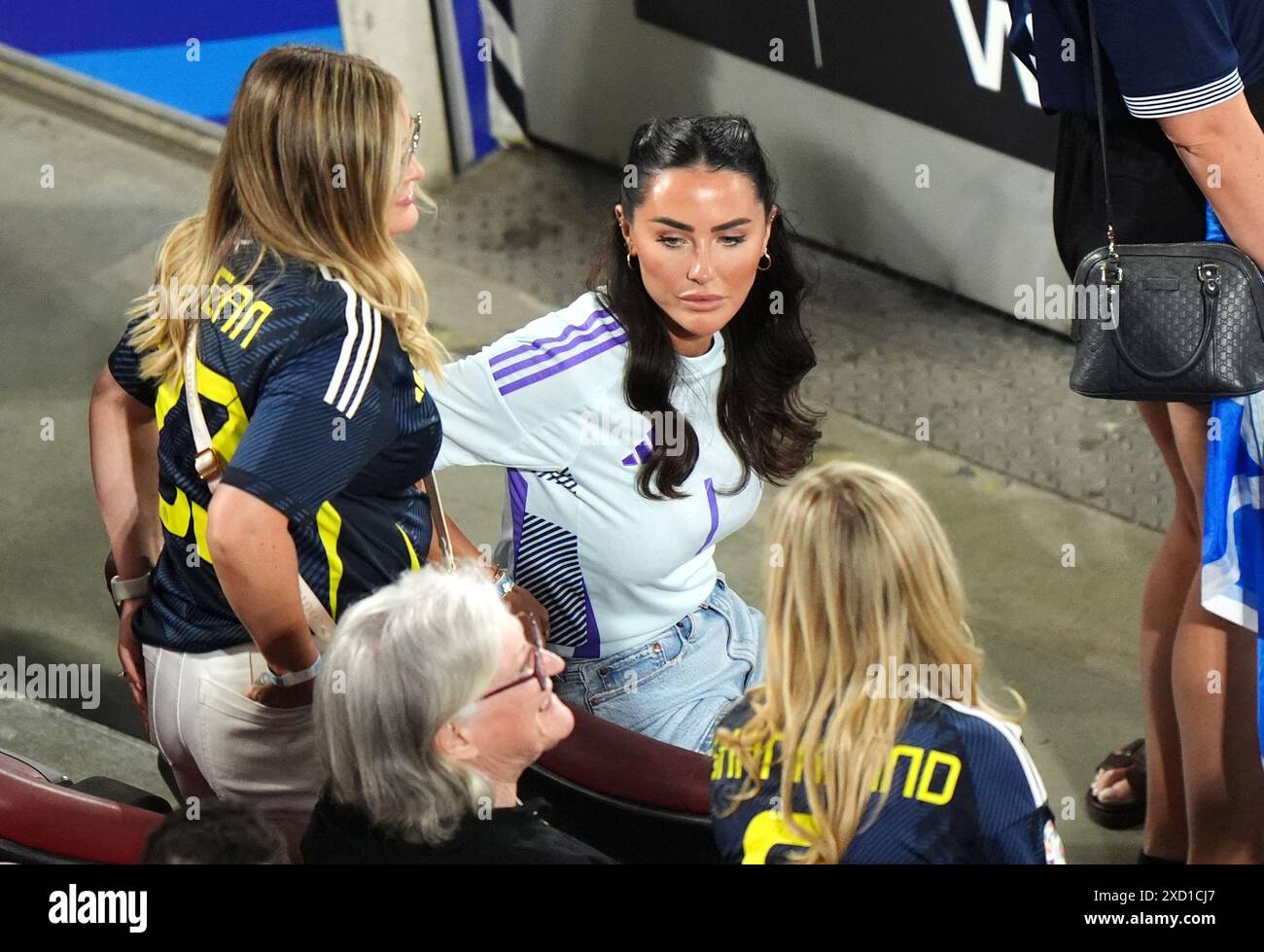 Jade Kelly Mills (centre), girlfriend of Scotland goalkeeper Angus Gunn ...