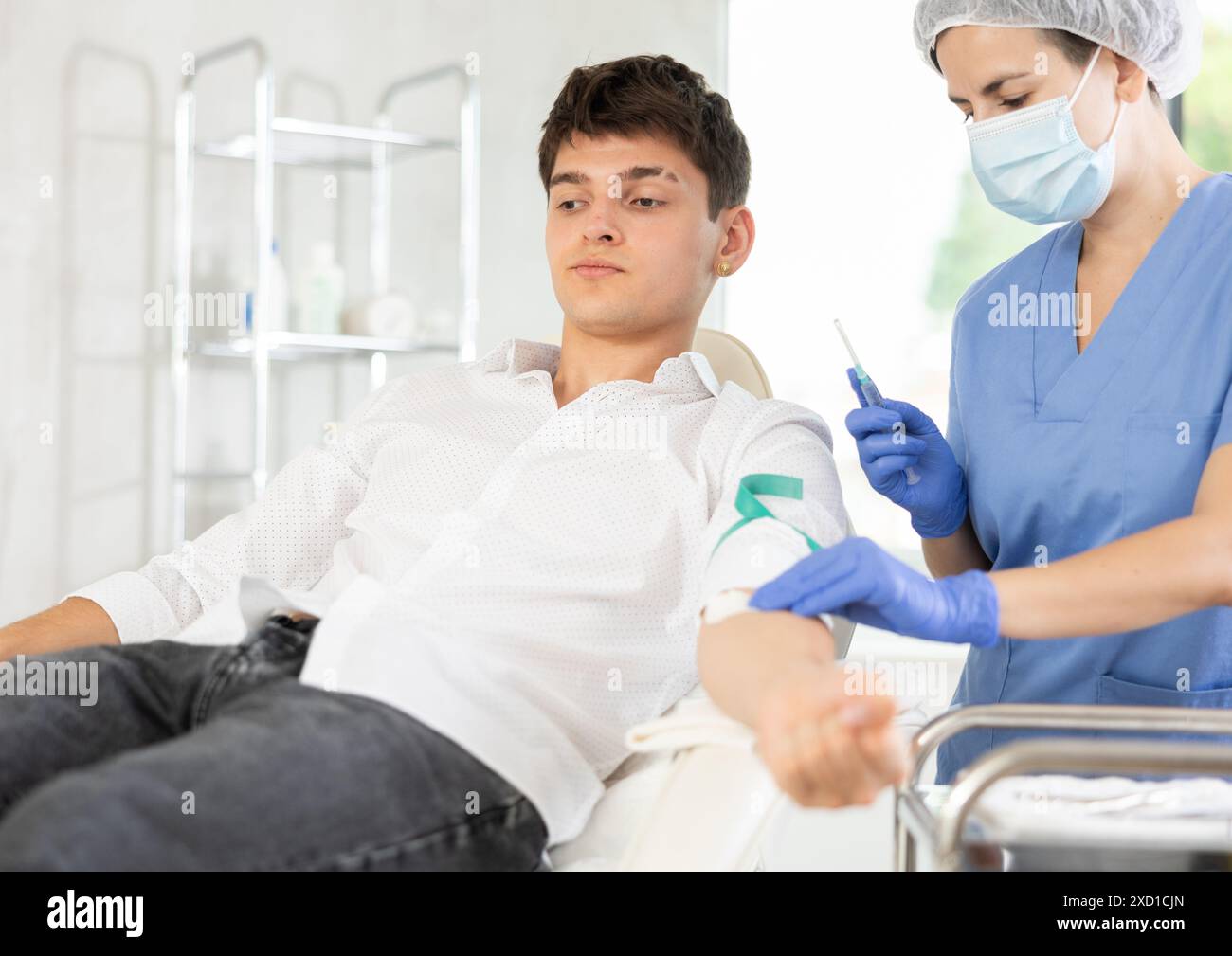 Intravenously injection male patient Stock Photo - Alamy