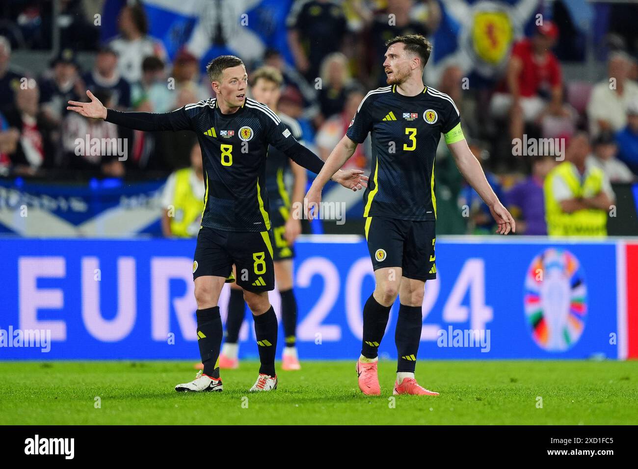 Scotland's Andrew Robertson (right) speaks with Callum McGregor during ...