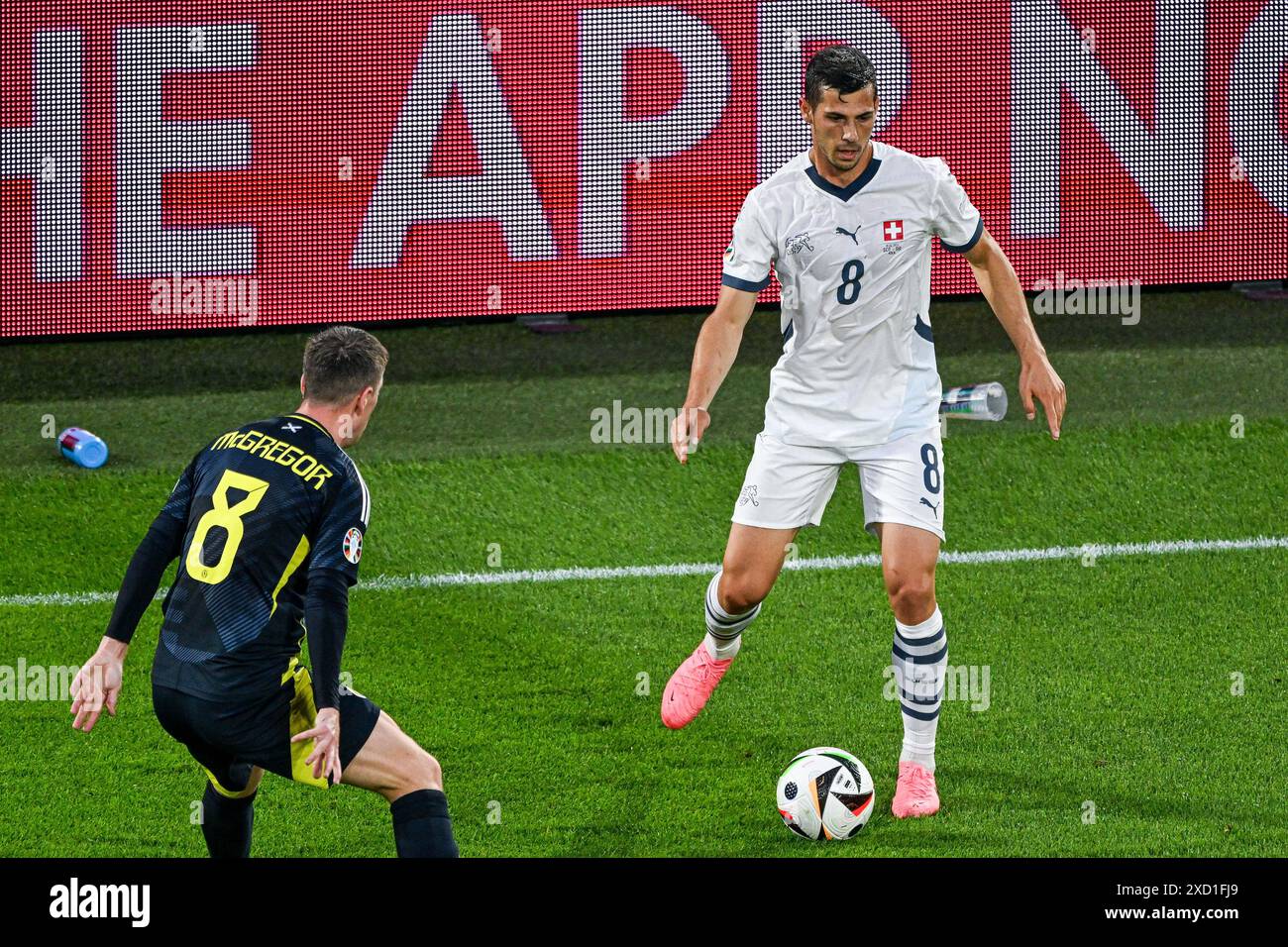 Callum McGregor (8) of Scotland and Remo Freuler (8) of Switzerland ...
