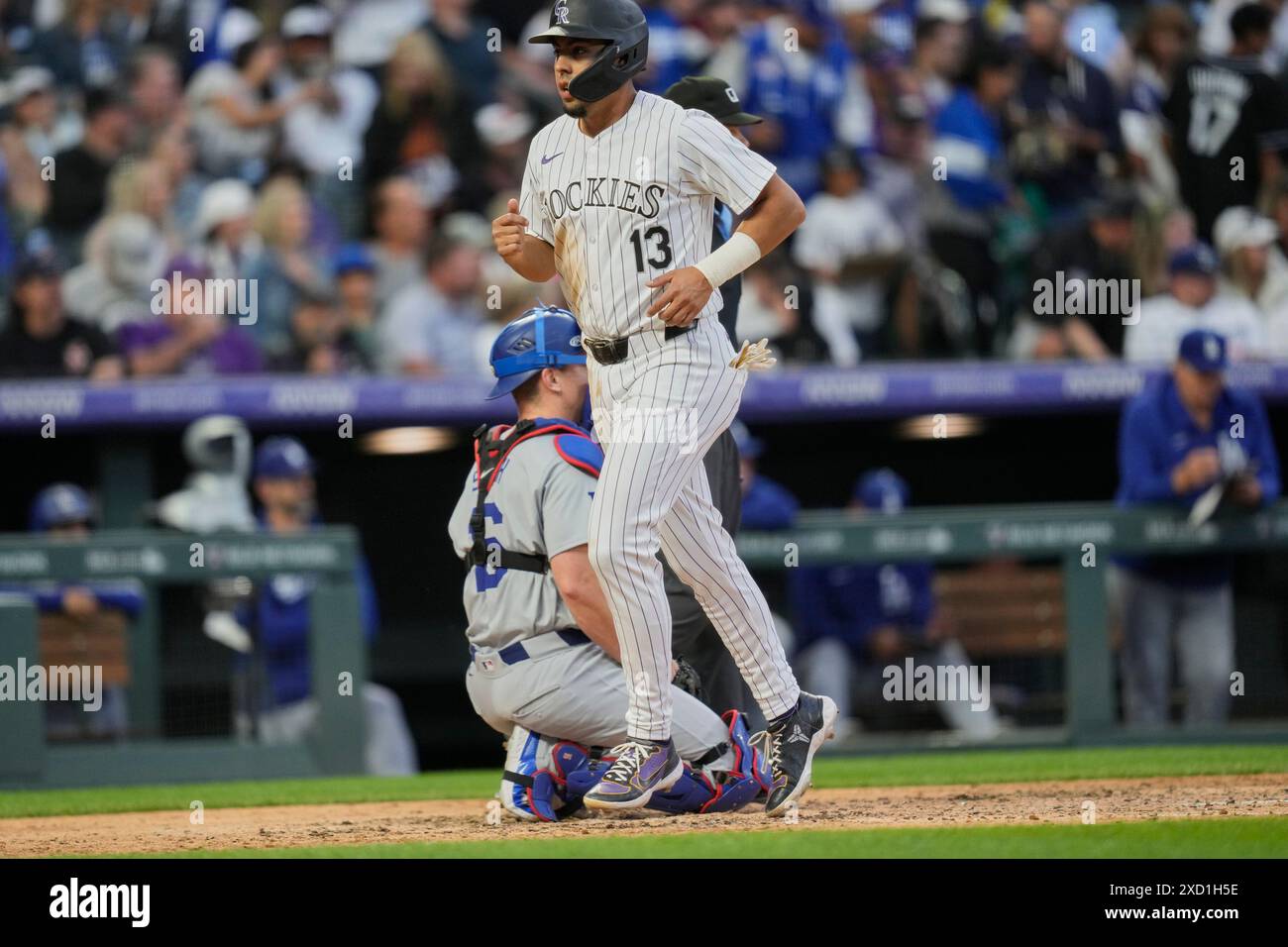 June 18 2024: Rockies second baseman Alan Trejo (13) scores a run ...
