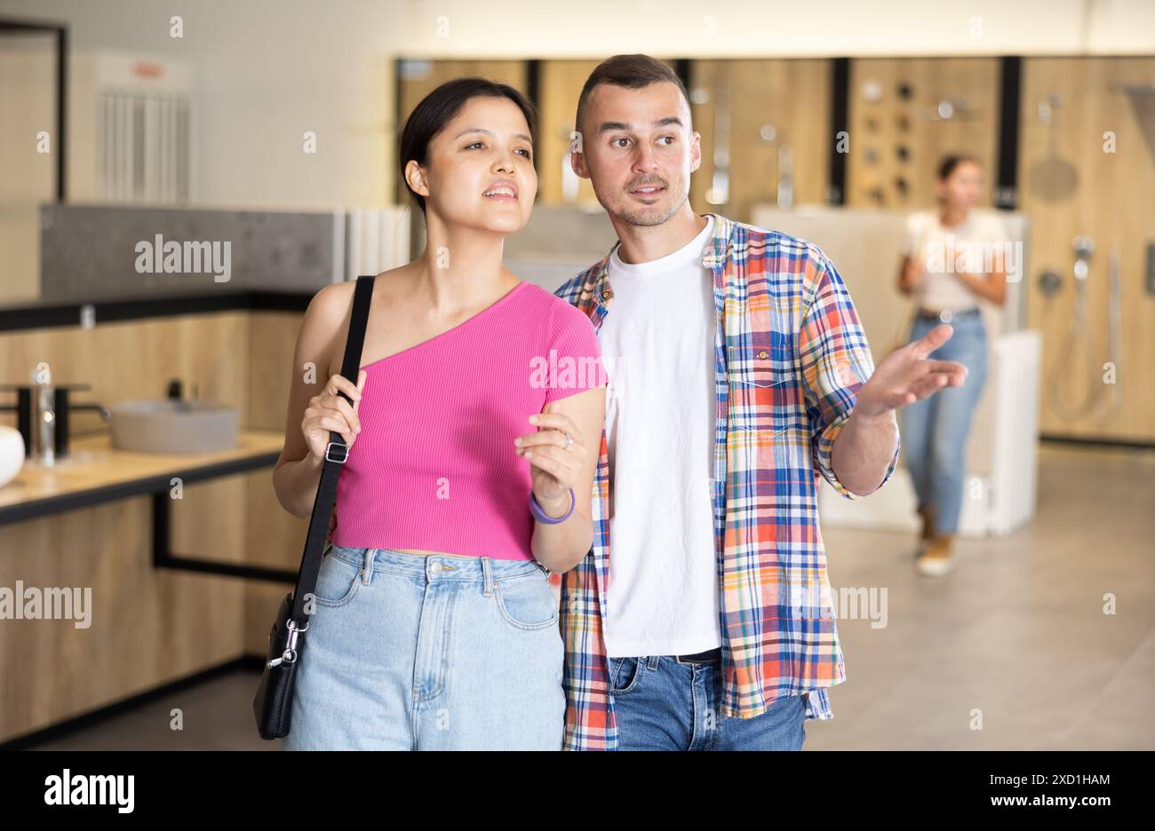 Man and woman looking around in bathroom department of store Stock ...