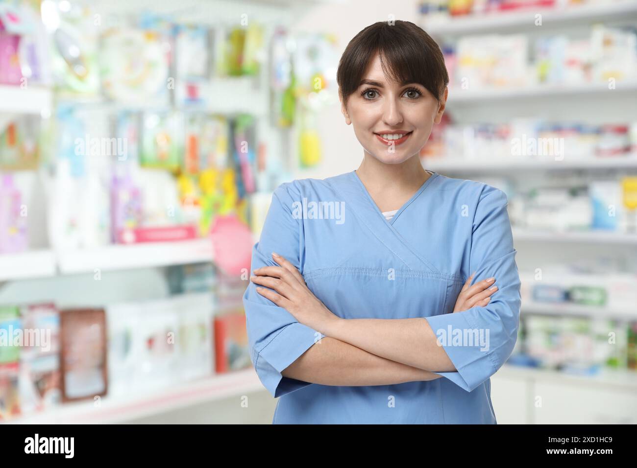 Positive pharmacist in uniform at drugstore. Space for text Stock Photo ...