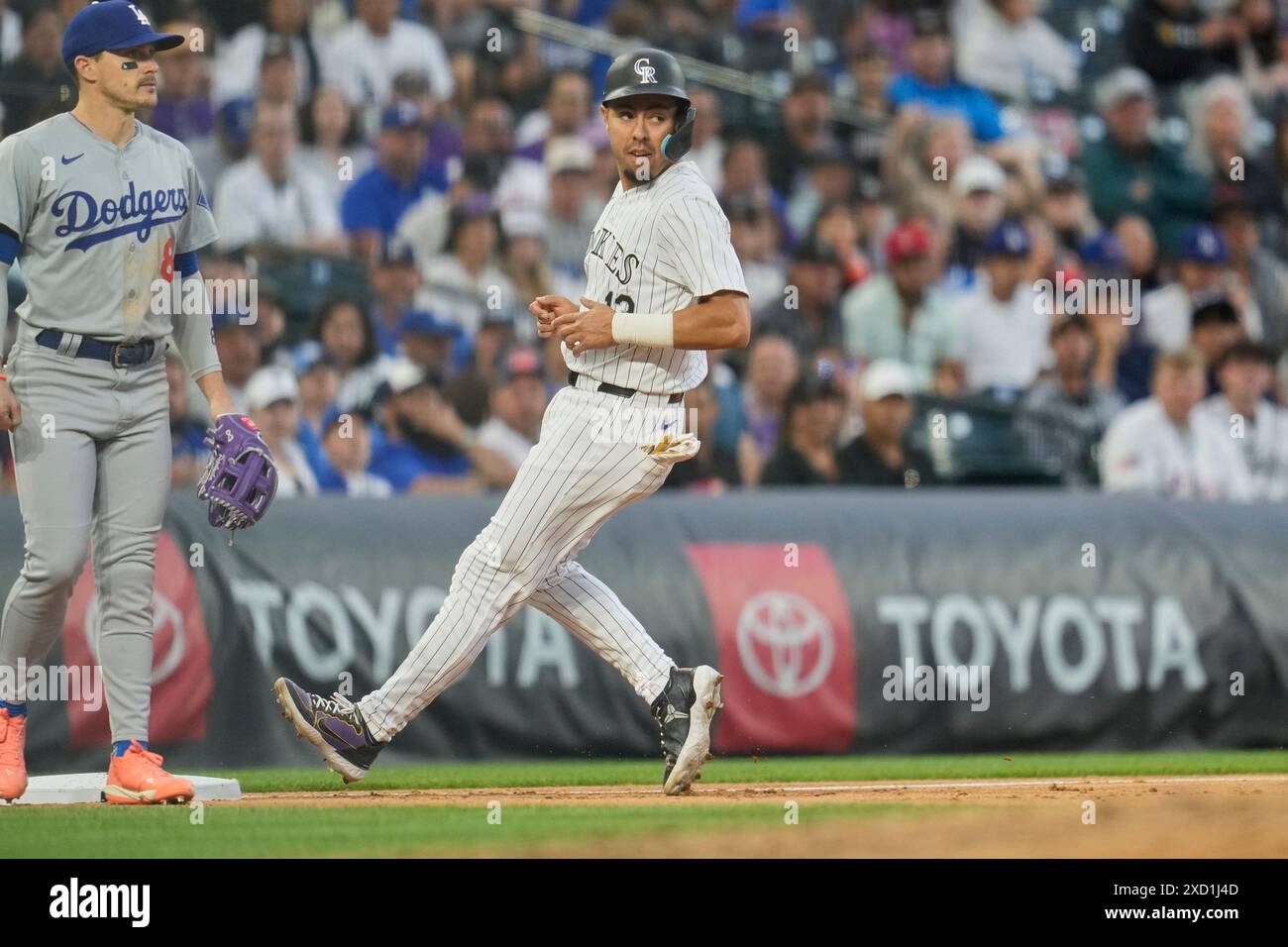 June 18 2024: Rockies second baseman Alan Trejo (13) runs to third ...