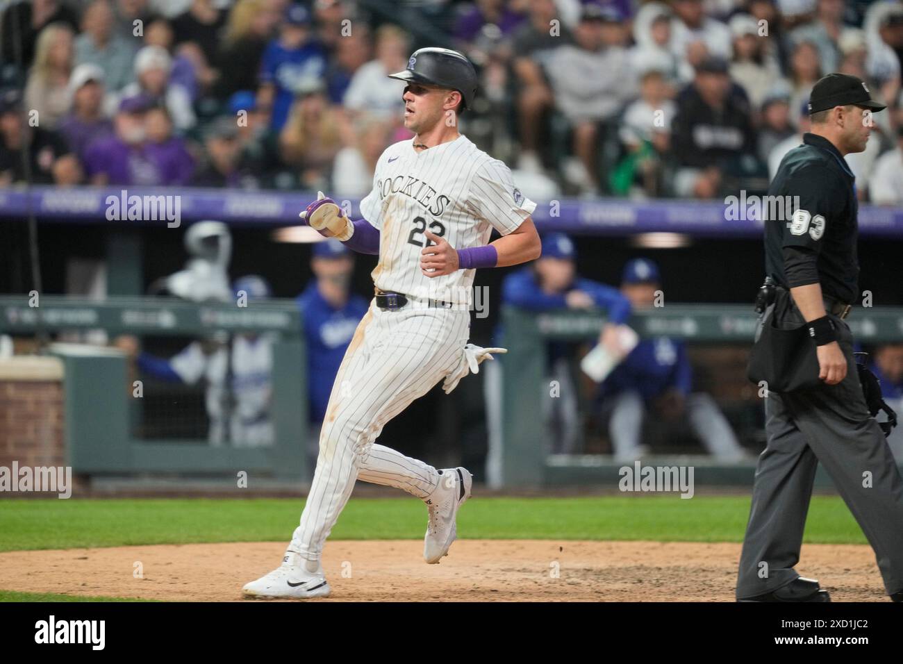June 18 2024: Rockies left fielder Nolan Jones (22) scores a run during ...