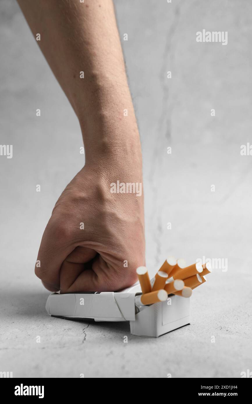 Hand crushing pack of cigarettes hi-res stock photography and images ...