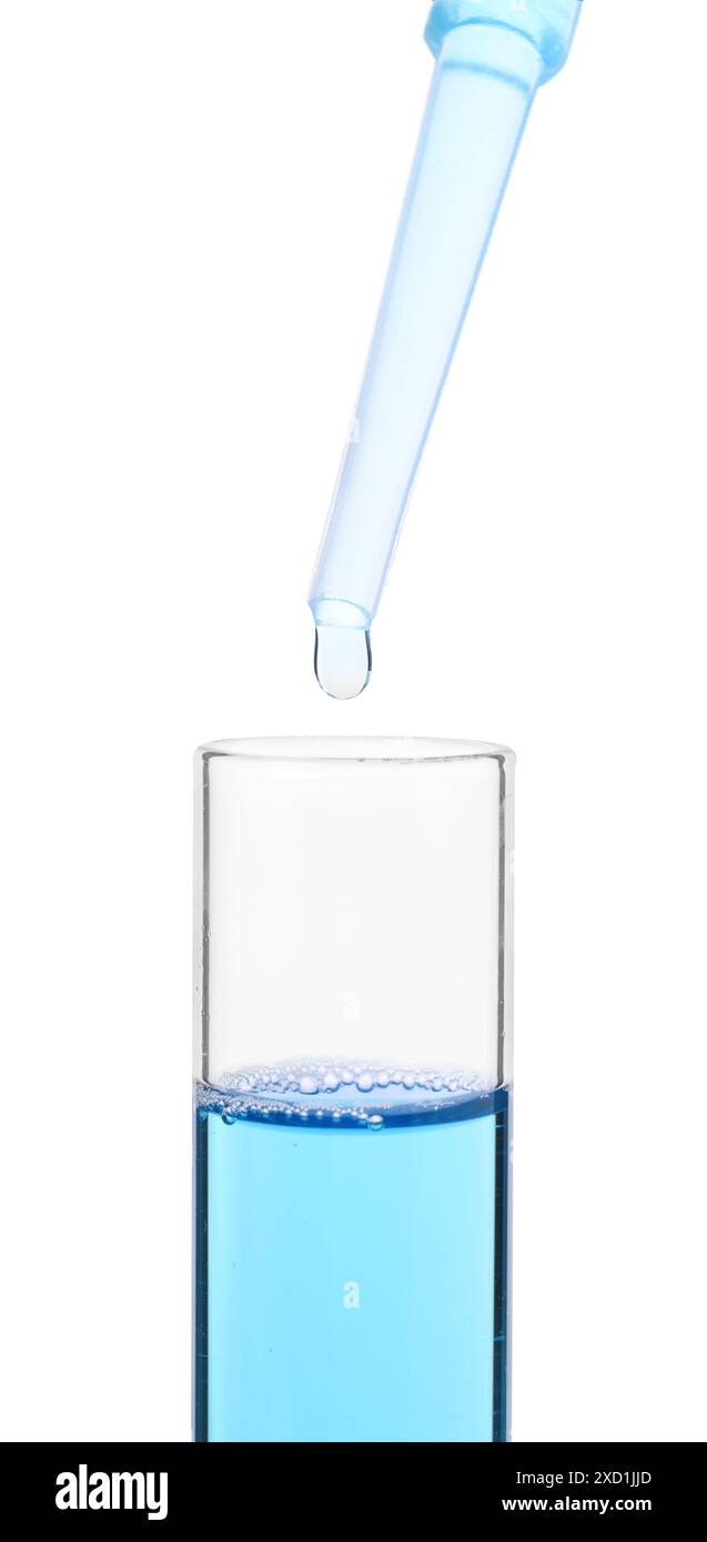 Dripping liquid from pipette into test tube isolated on white, closeup ...