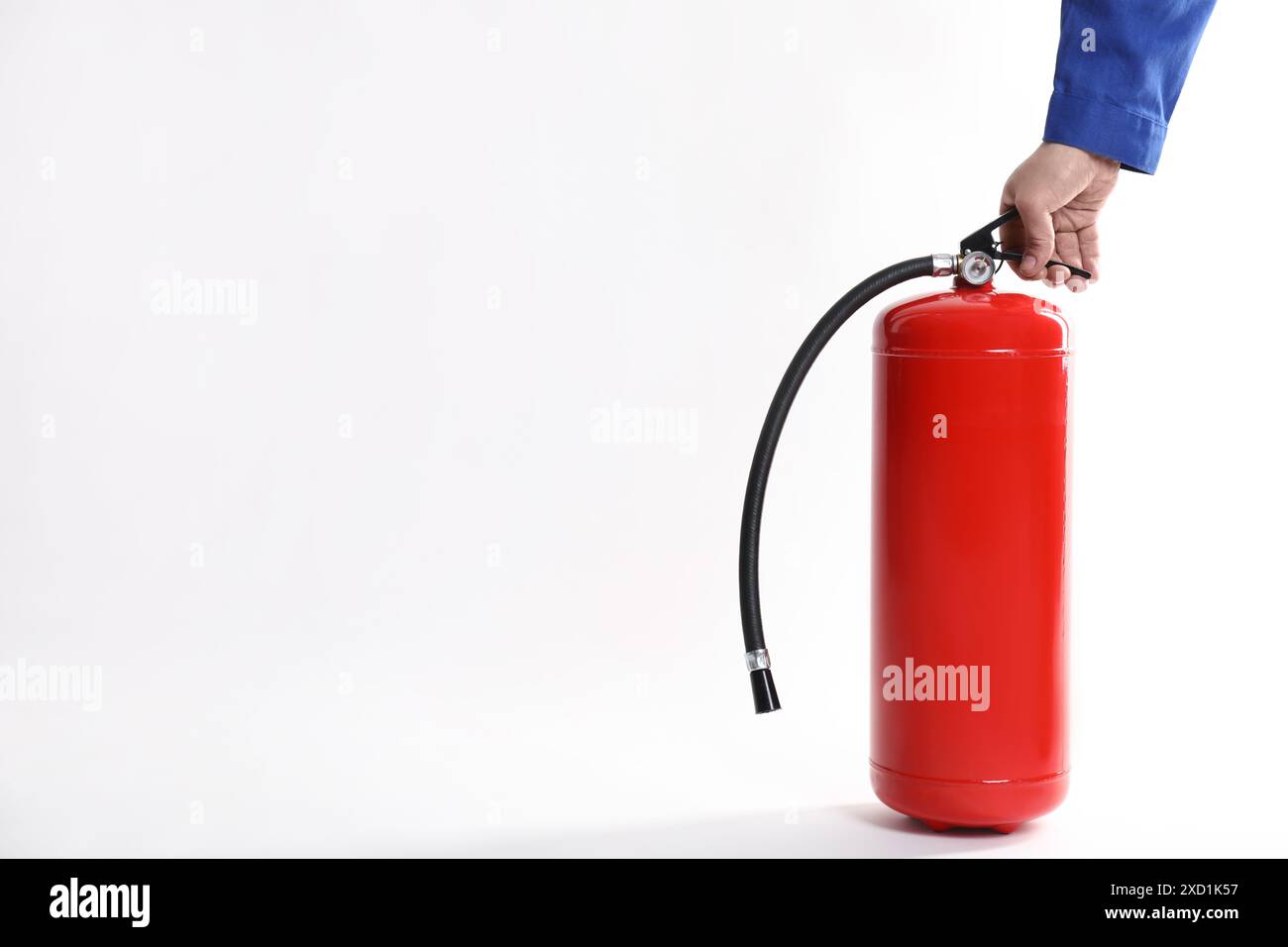 Man fire extinguisher on hi-res stock photography and images - Alamy