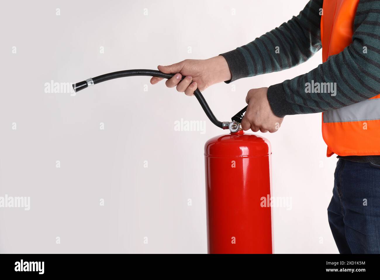Man fire extinguishing hi-res stock photography and images - Alamy